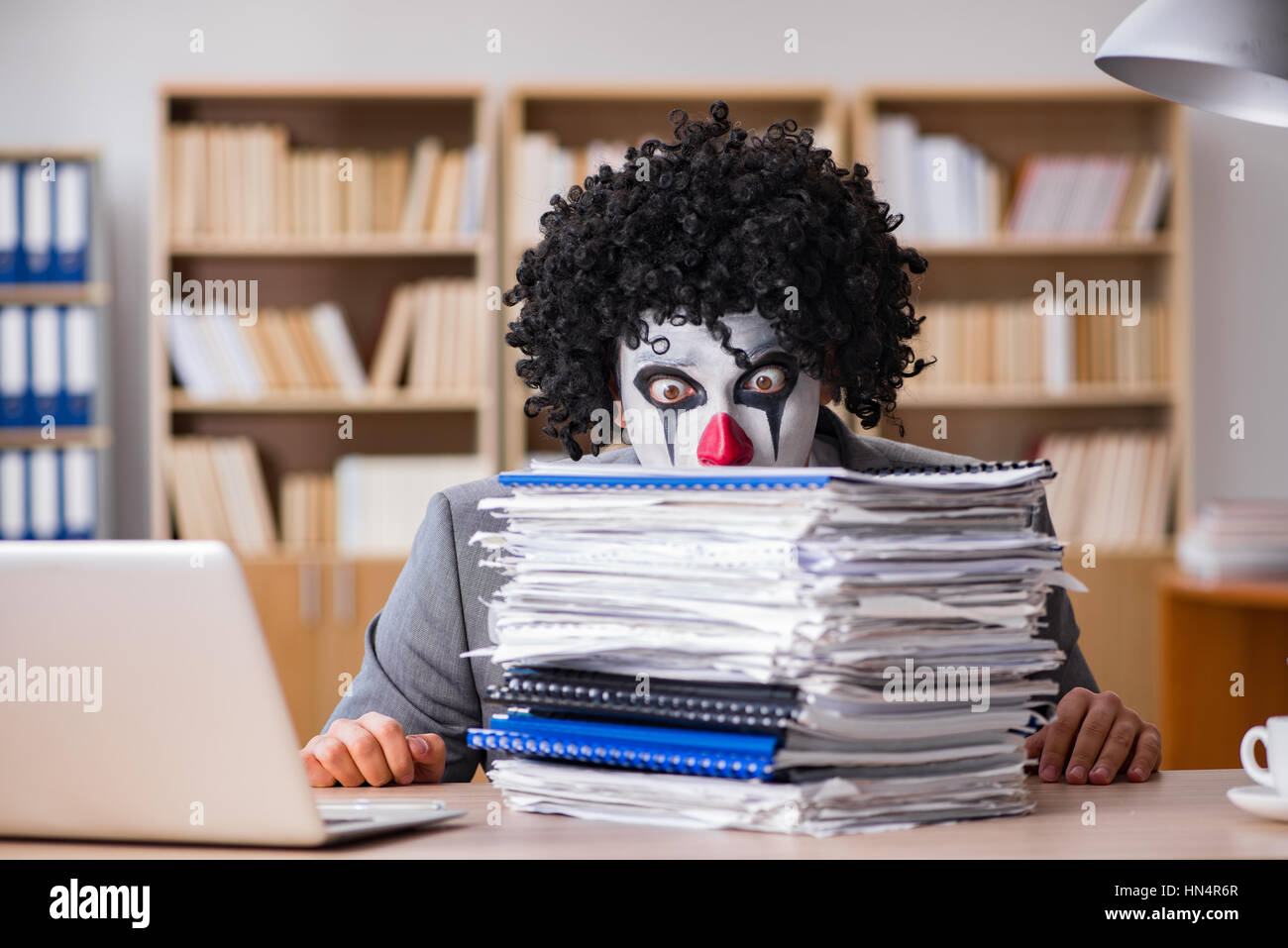 Clown businessman working in the office Stock Photo - Alamy