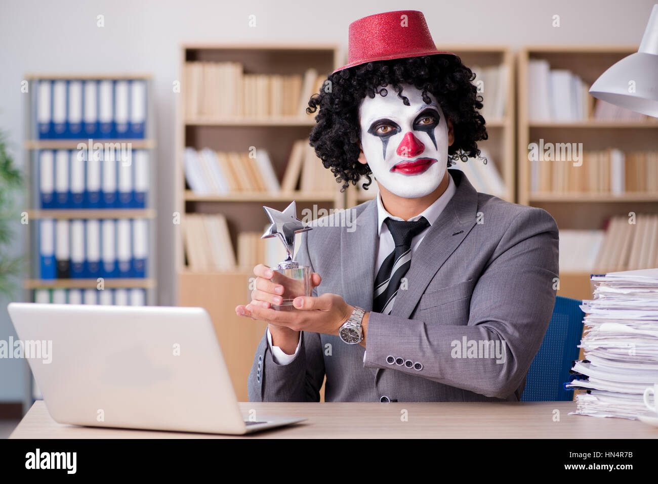 Clown businessman working in the office Stock Photo - Alamy