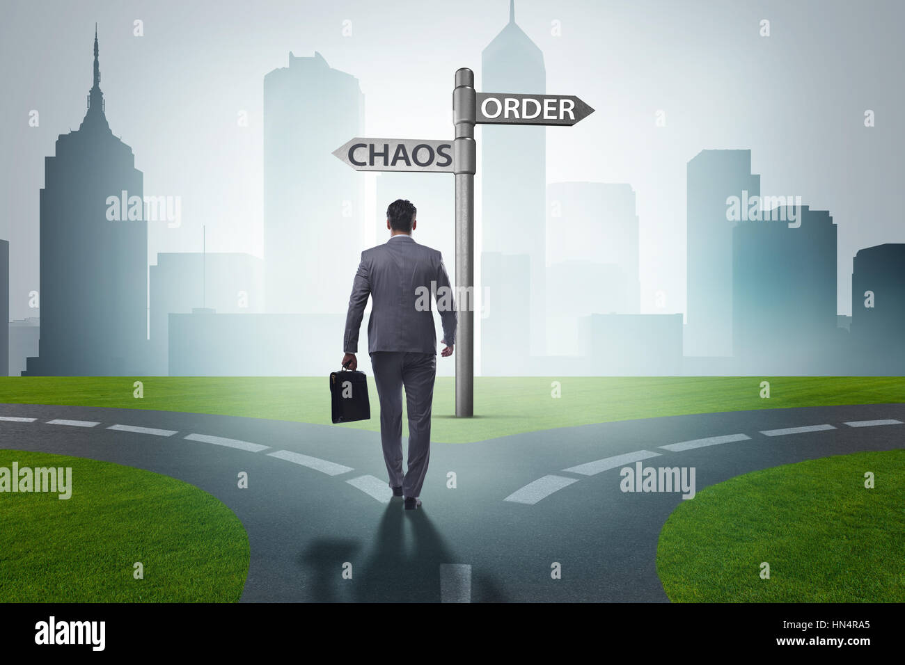 Businessman in difficult choice concept Stock Photo - Alamy