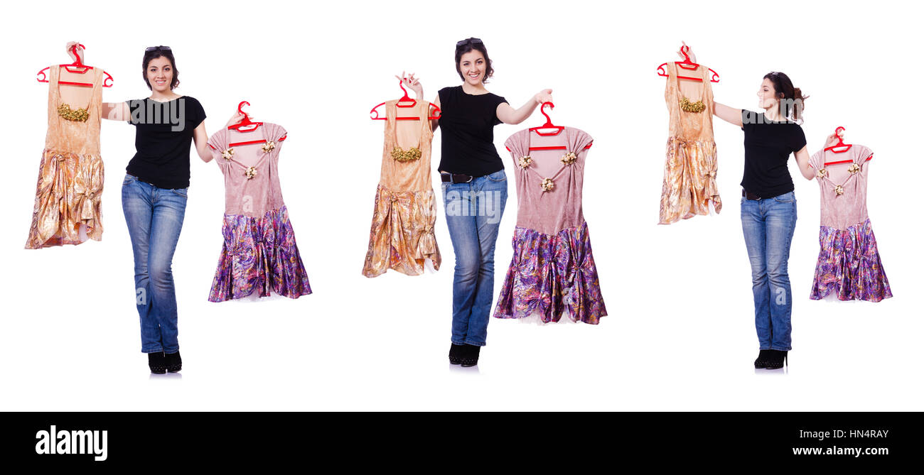Woman trying to choose dress on white Stock Photo - Alamy