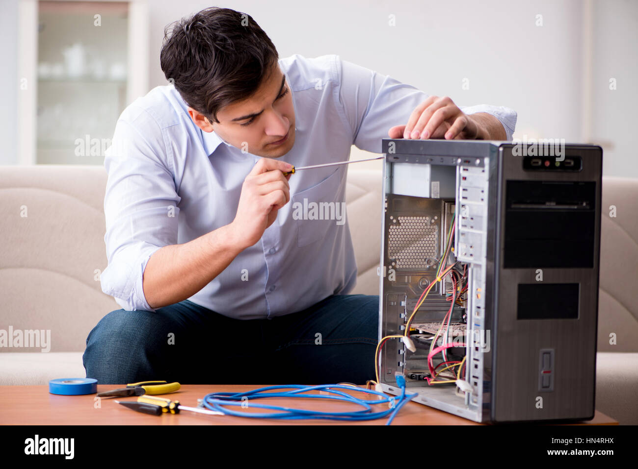 IT technician repairing broken pc desktop computer Stock Photo - Alamy