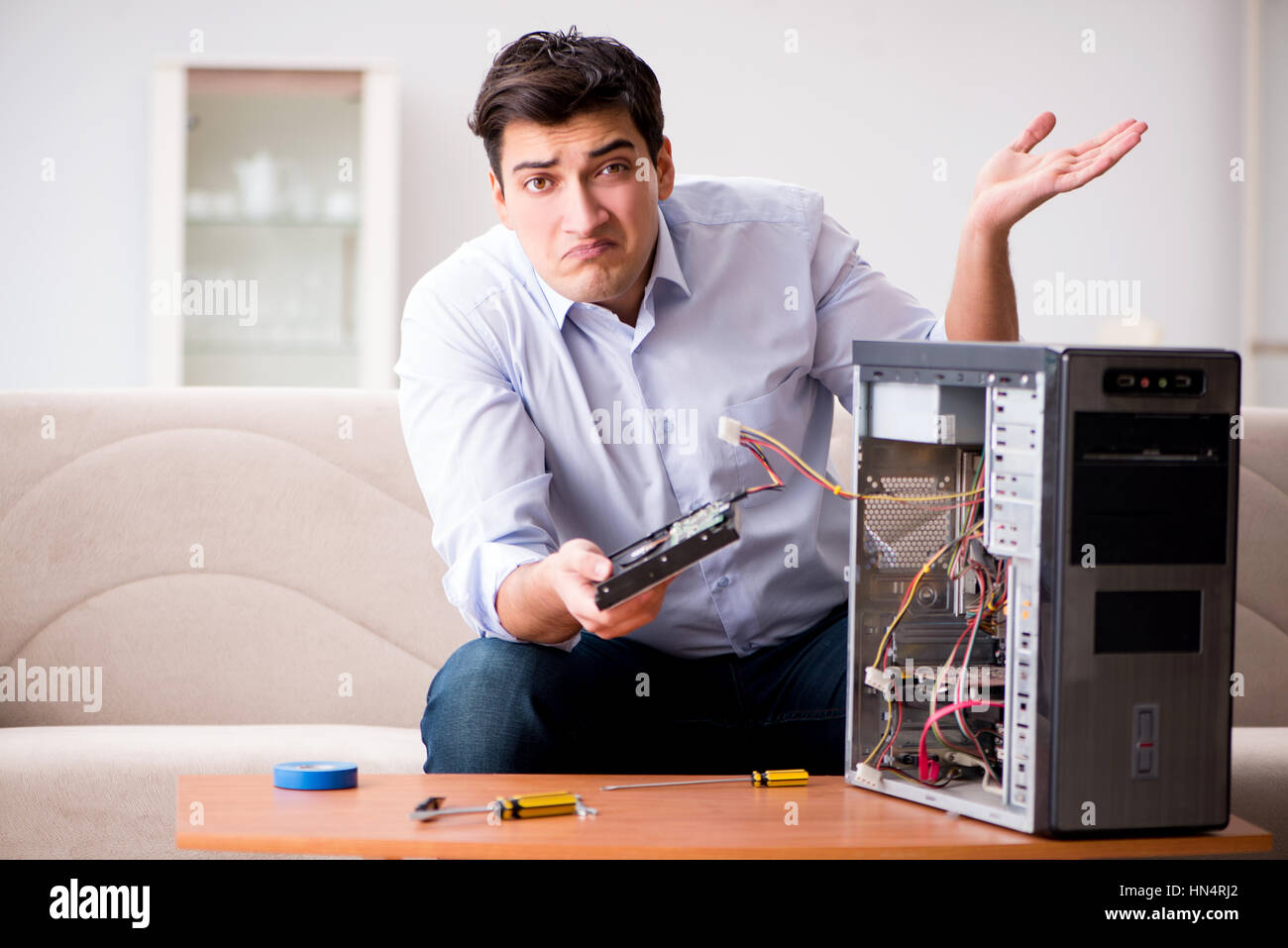 Frustrated man with broken pc computer Stock Photo - Alamy