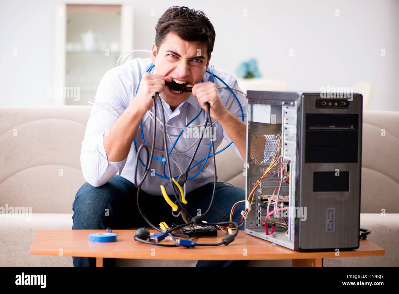 Frustrated man with broken pc computer Stock Photo - Alamy