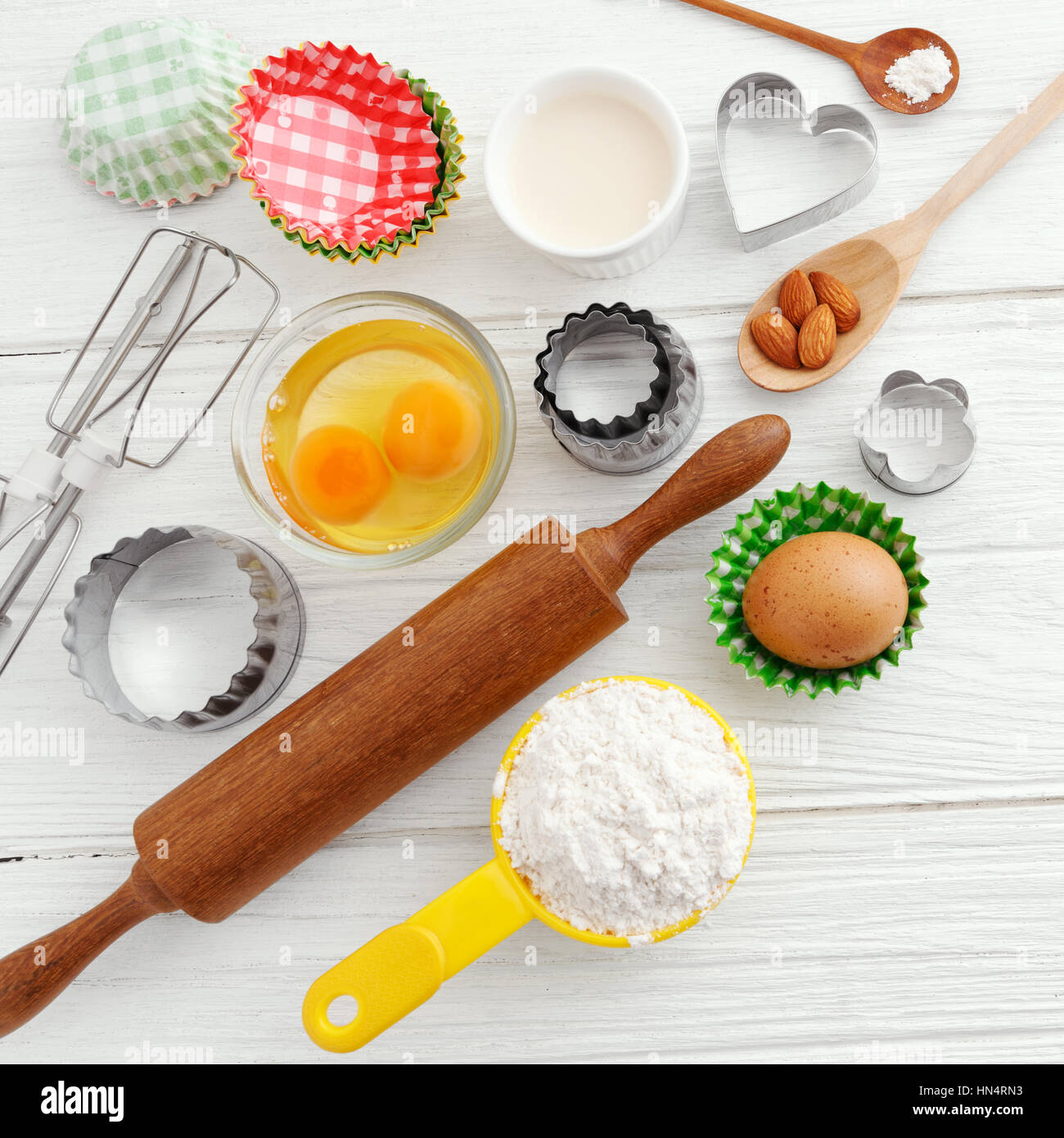 Baking ingredients and utensils on white wooden table Stock Photo - Alamy