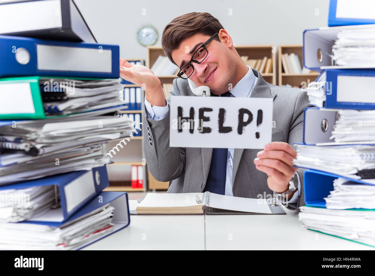 Busy businessman asking for help with work Stock Photo - Alamy