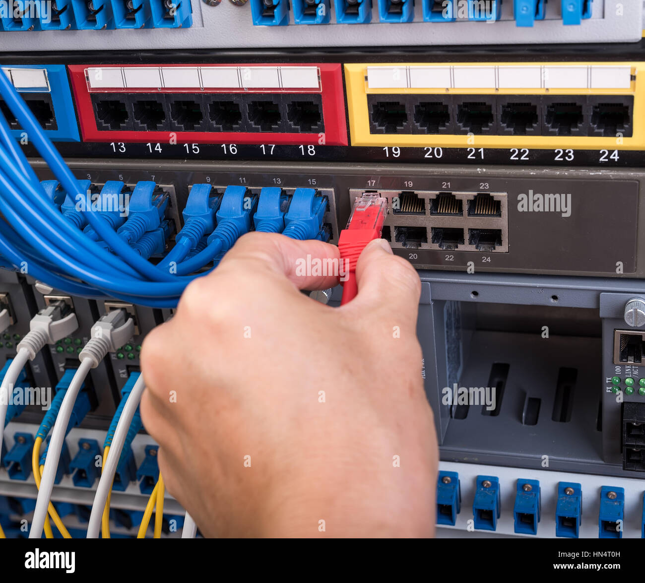 hand with network cables connected to servers Stock Photo - Alamy