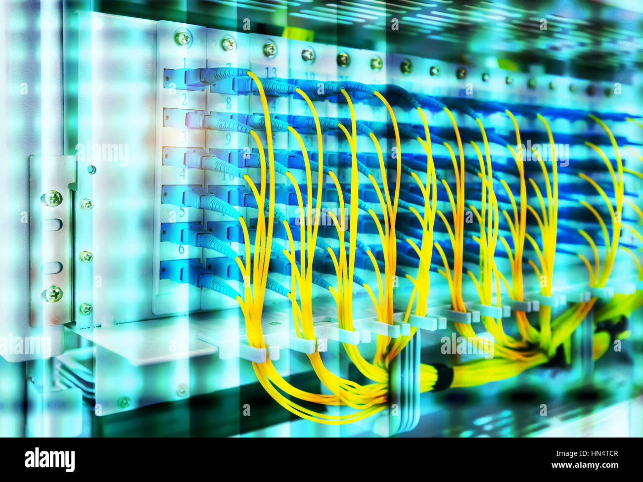 Fiber Optic cables connected to an optic ports and Network cables ...