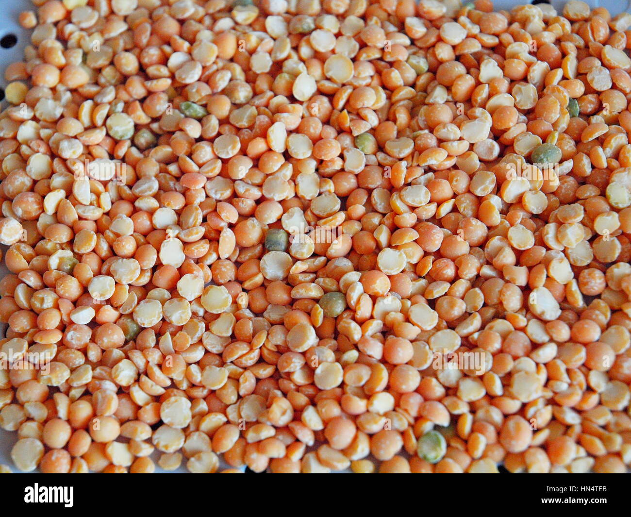 Raw yellow split peas close up Stock Photo - Alamy