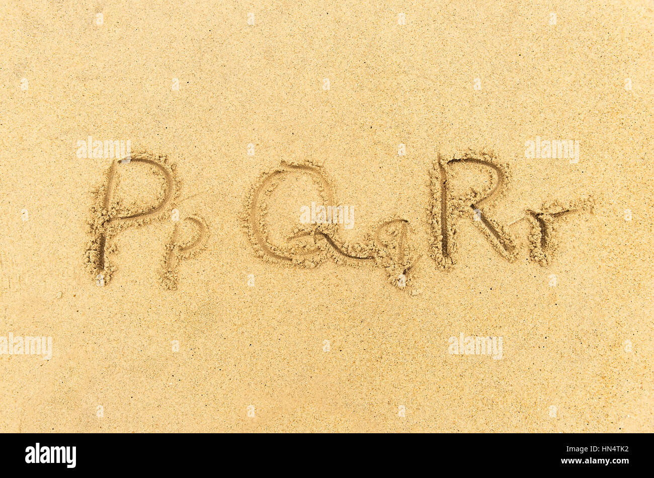 alphabet letters handwritten in sand on beach Stock Photo - Alamy
