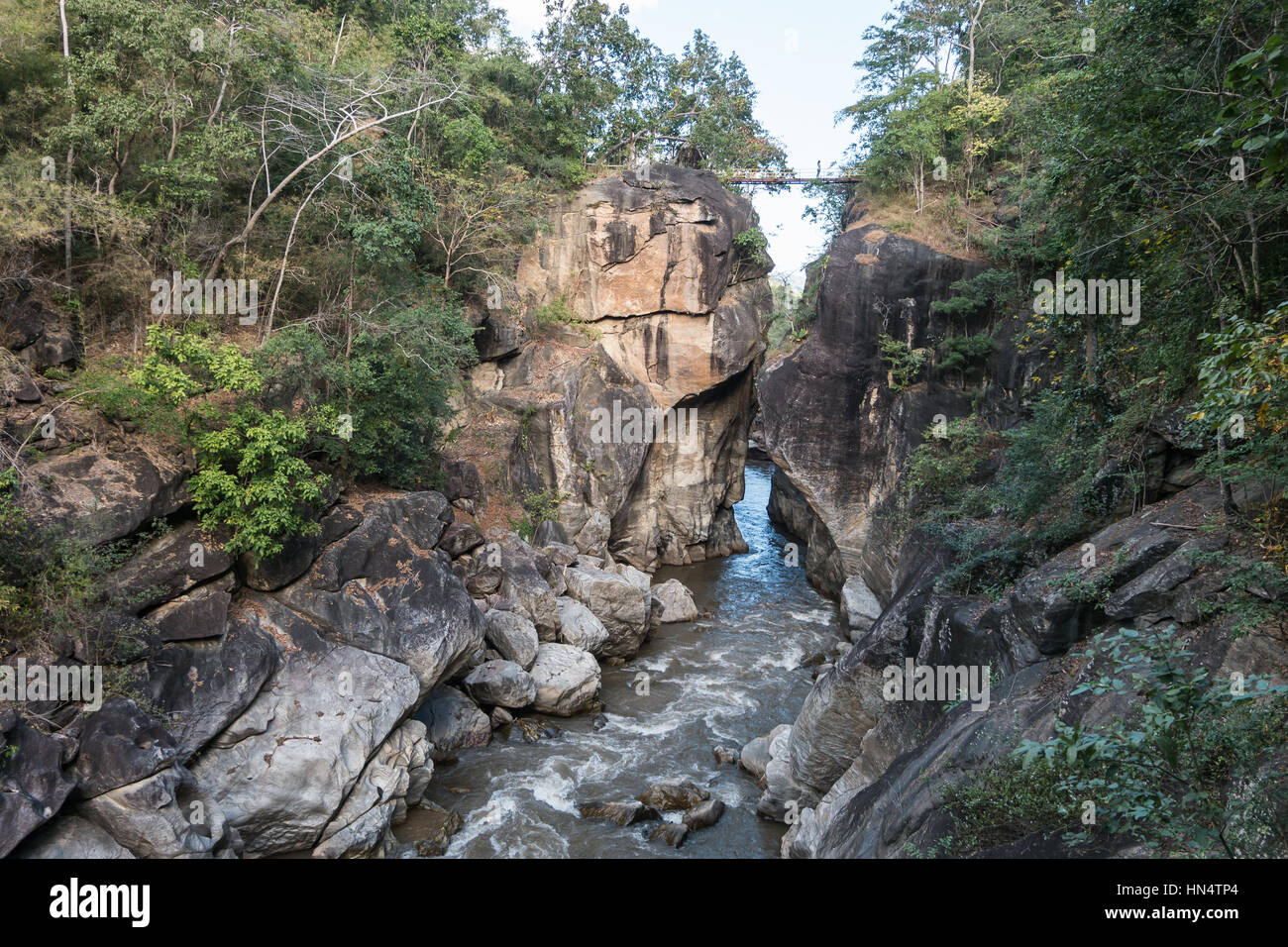 Small bridge over the river with big cliff at Ob Luang National Park ...