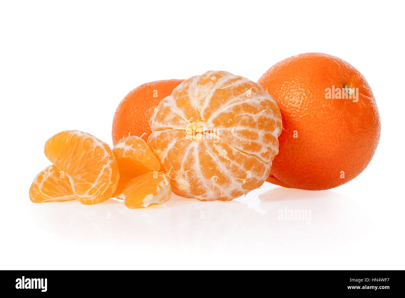 Clementines with a peeled clementine isolated on white background Stock ...