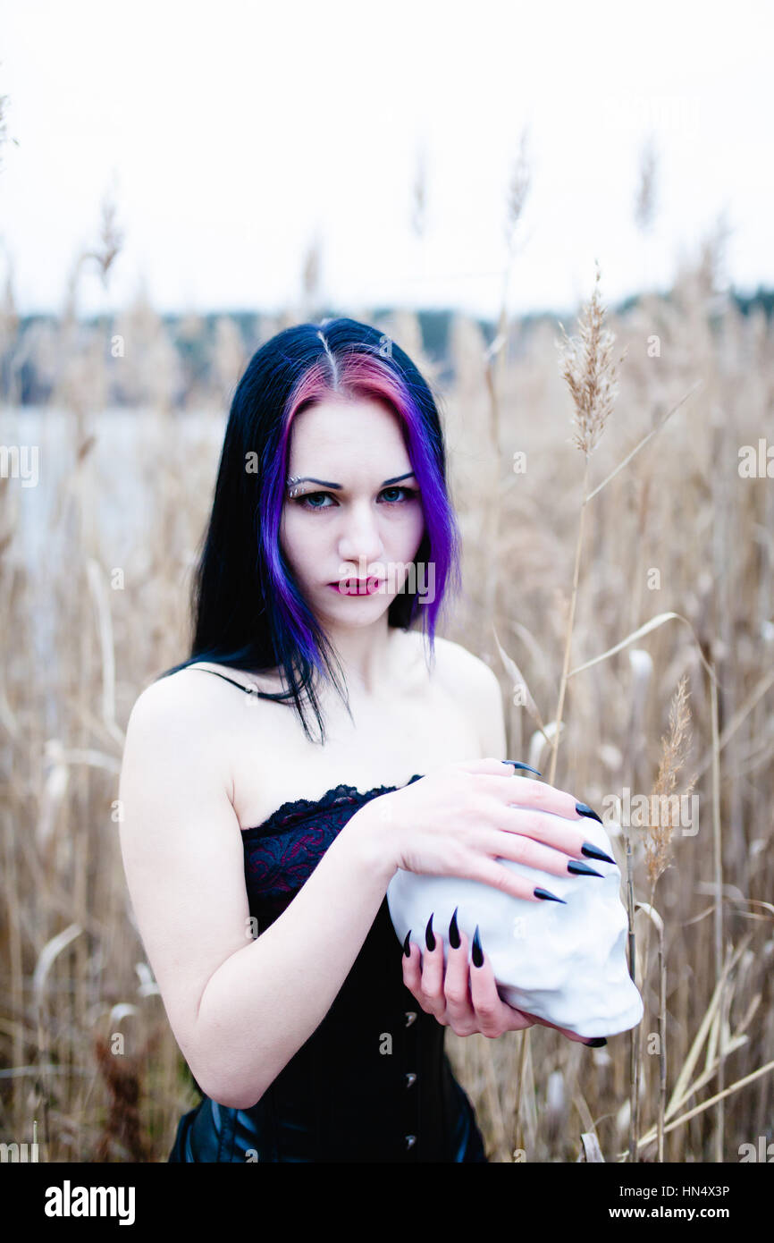 Portrait of the gothic woman in the dark winter forest Stock Photo - Alamy