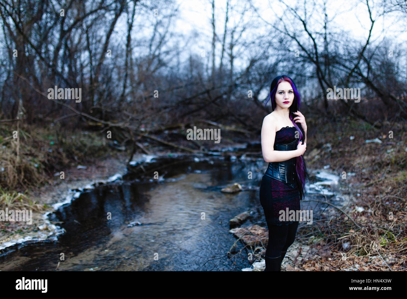 Portrait of the gothic woman near the cold creek Stock Photo - Alamy
