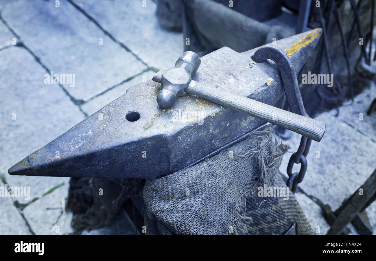 Blacksmith anvil and hammer, detail of utensils and a traditional ...