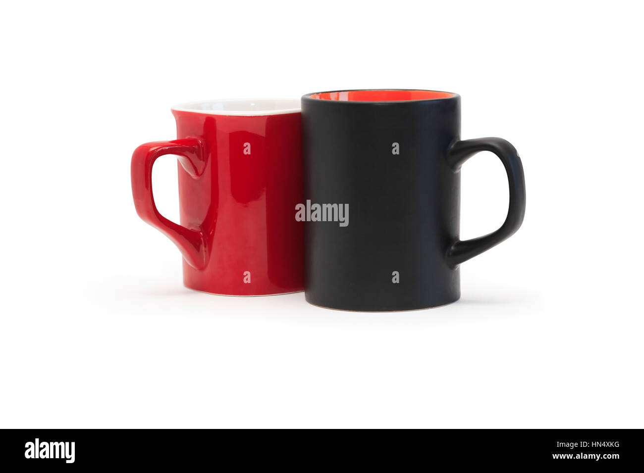 Stylish modern red and black mugs on white background. Clipping path is ...