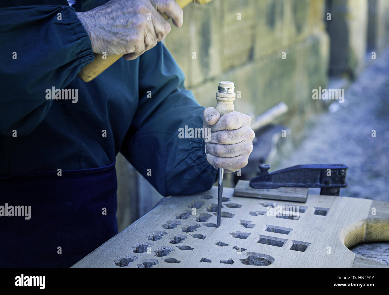 Man carving wood, detail of a traditional craft, creation Stock Photo ...