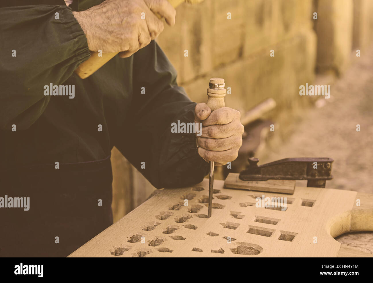 Man carving wood, detail of a traditional craft, creation Stock Photo ...