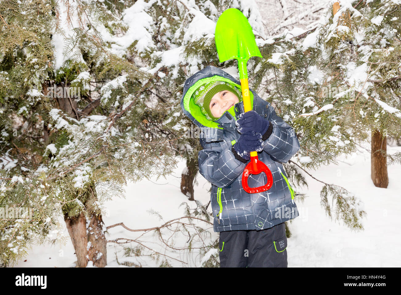 Close up portrait of adorable happy little boy grinning happily at the ...
