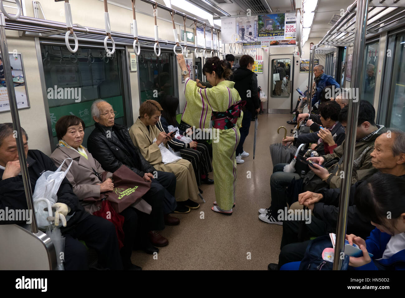 Asian people, tourists, commuters, young couple traveling on train in ...