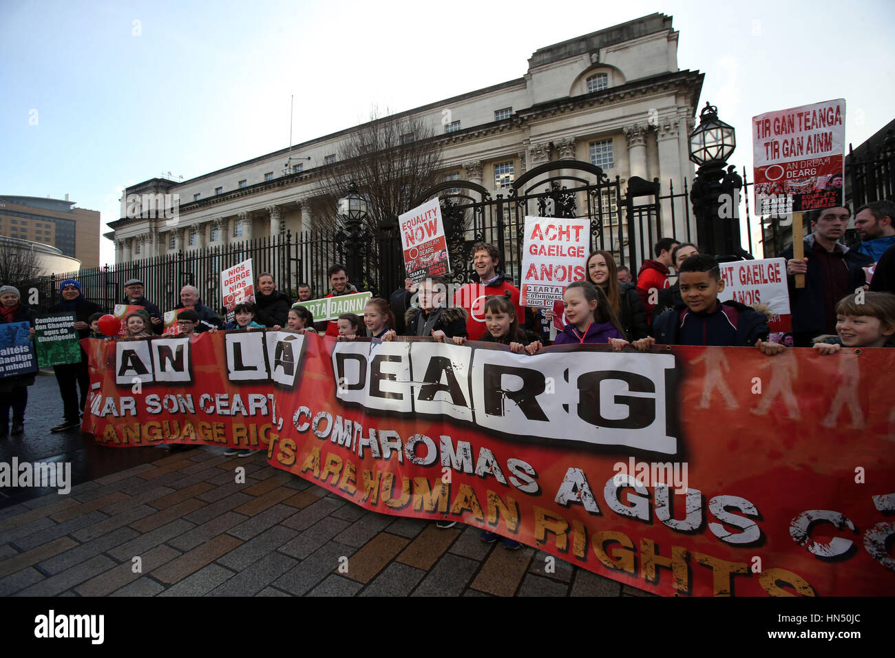 Irish language campaigners from across Northern Ireland hold a banner ...