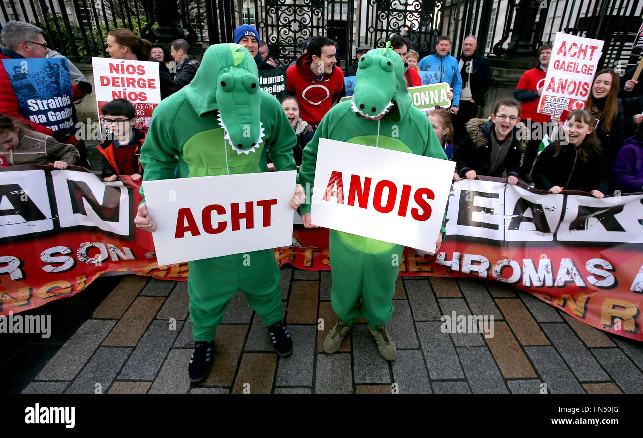 Irish language campaigners dressed as crocodiles protest over Stormont ...