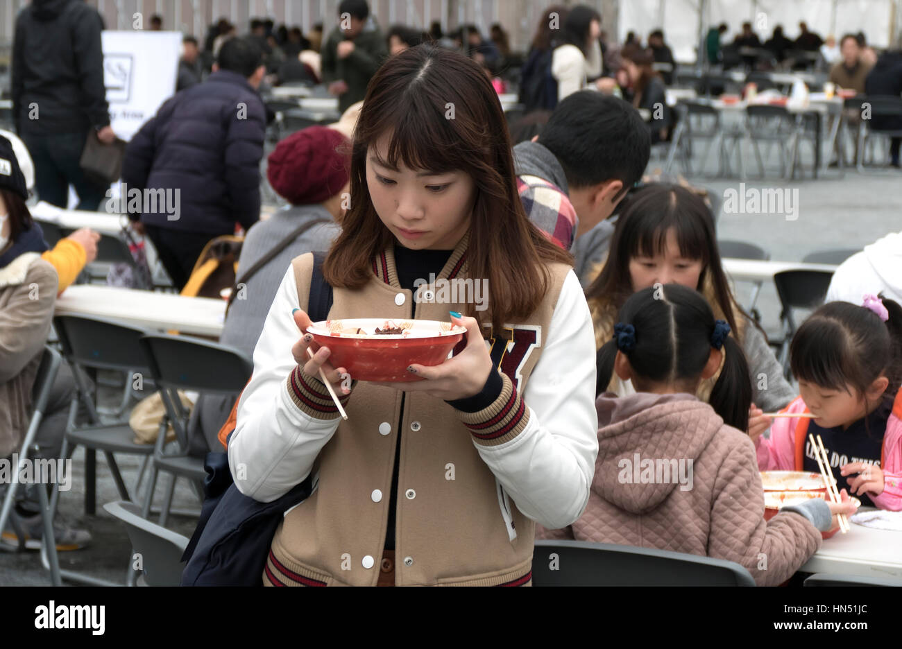 Japanese people, families, tourists eating traditional Asian street ...