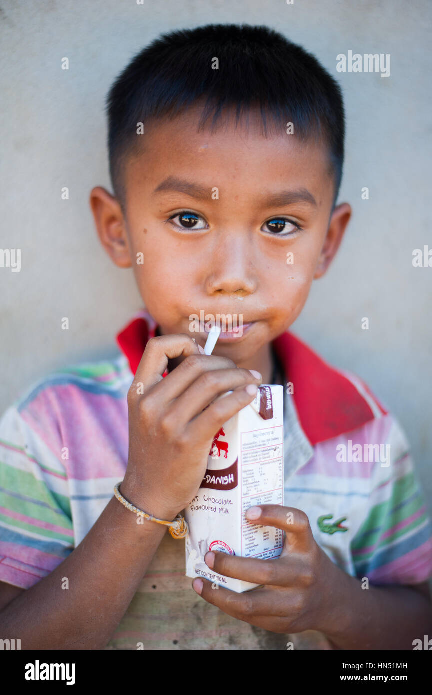 Poor child drinking milk hi-res stock photography and images - Alamy