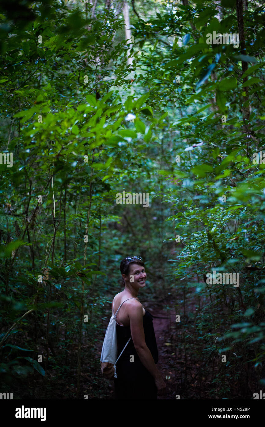 Woman walking in the exotic forest hi-res stock photography and images ...