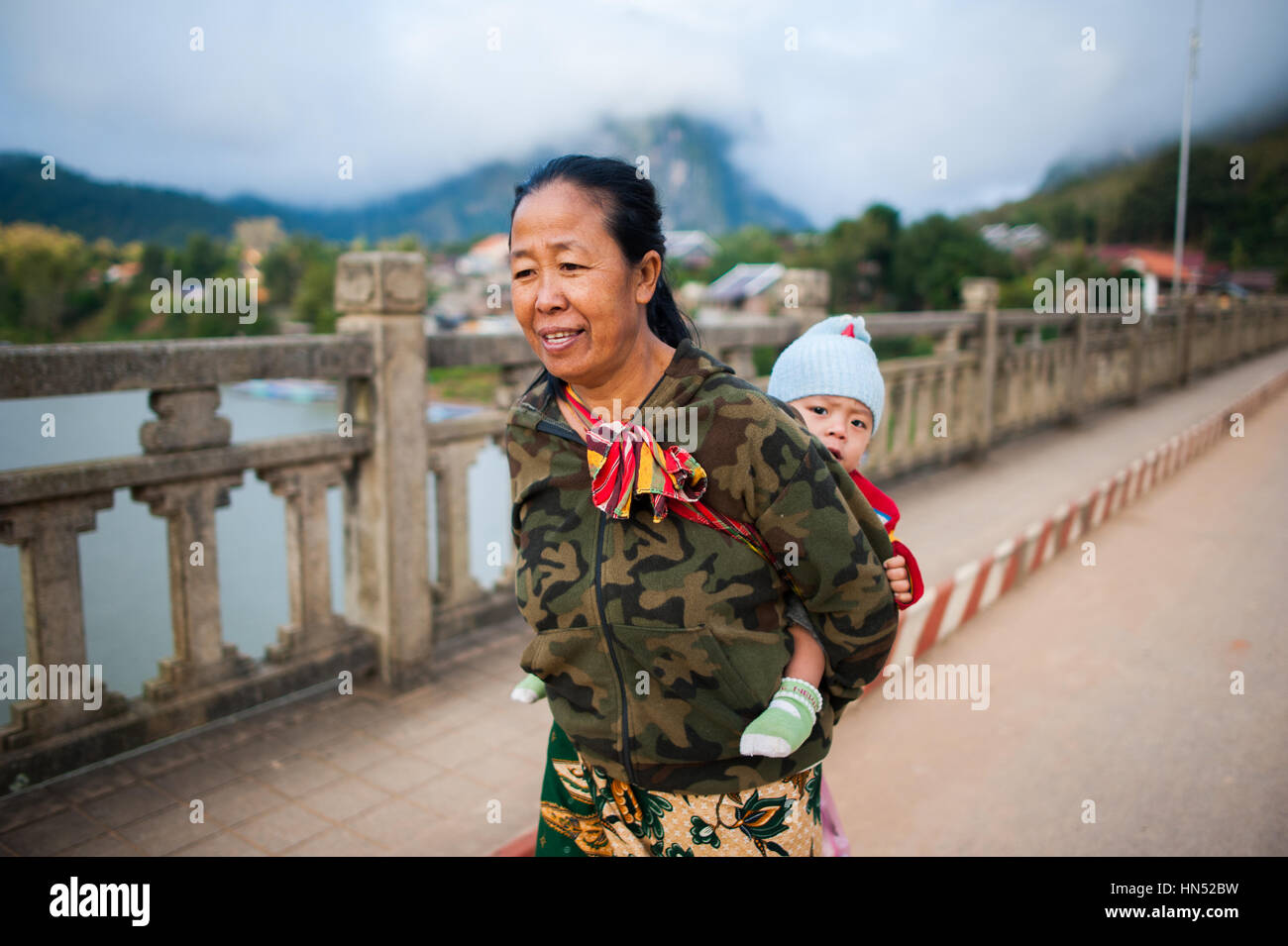 Mother carrying her kid on back hi-res stock photography and images - Alamy