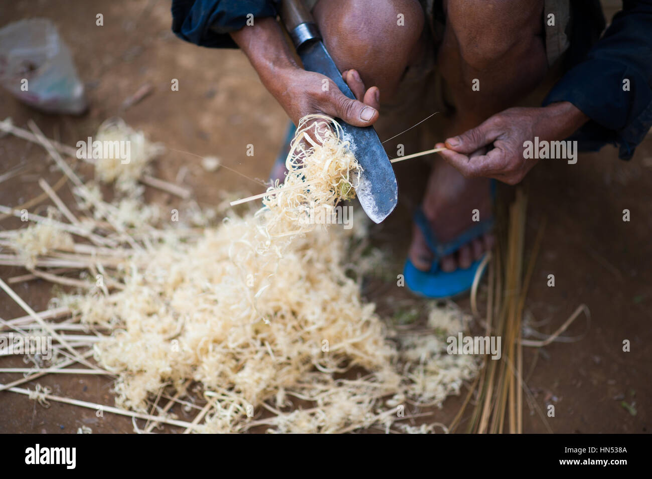 Asian man working with bamboo Stock Photo - Alamy