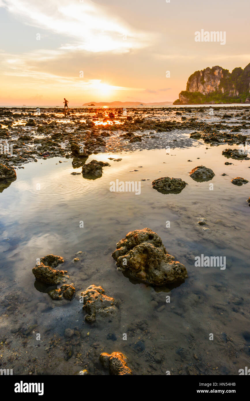 Beautiful sunset with seascape and stone Stock Photo - Alamy