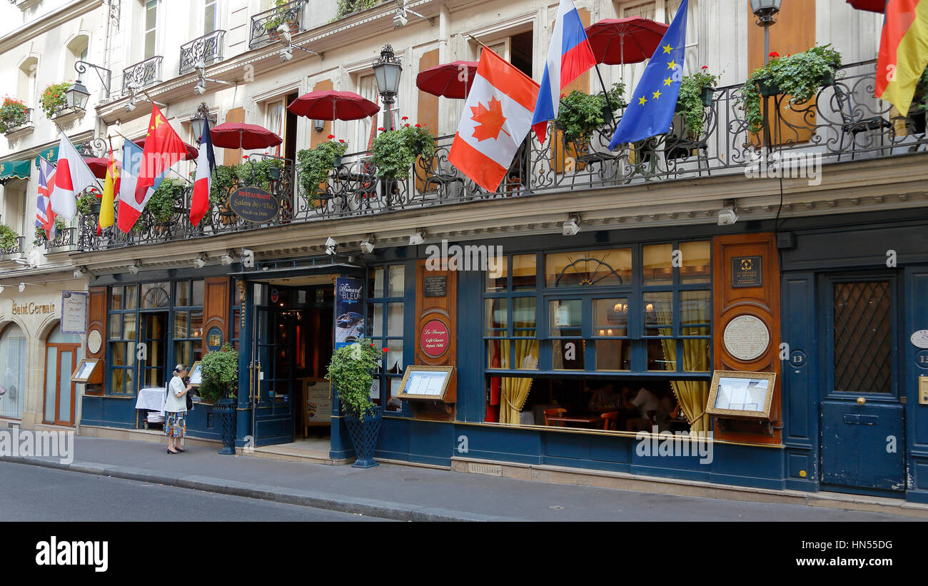 The Cafe Procope in Paris with portraits of famous writers and ...