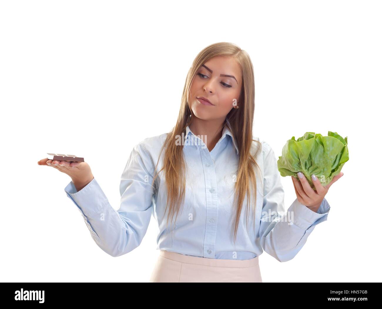 Attractive woman choosing between chocolate hi-res stock photography ...