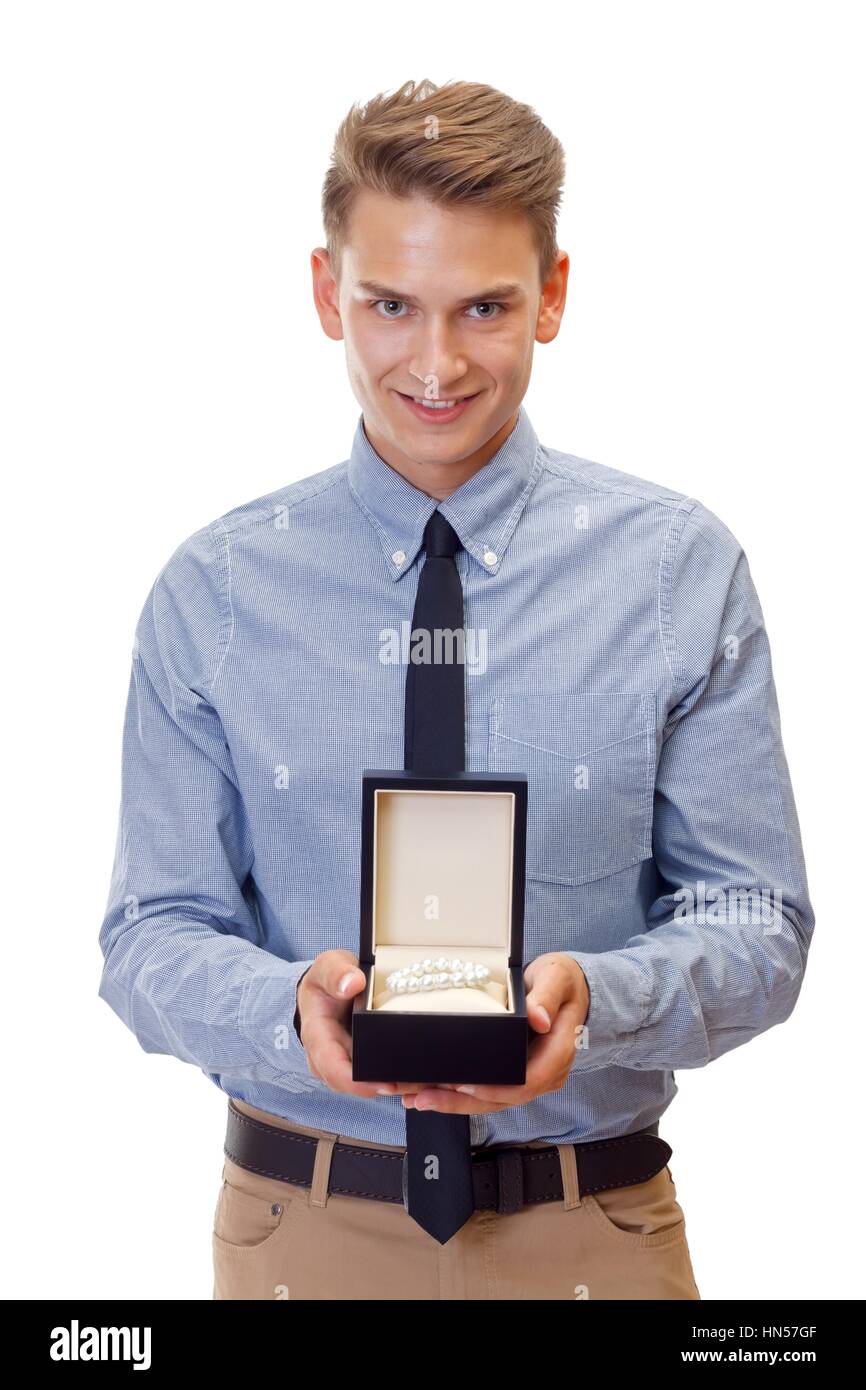 Portrait of a man, holding a present on isolated background Stock Photo ...