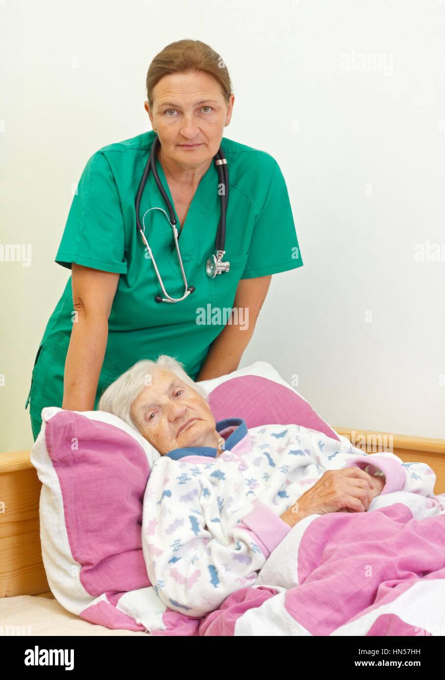 Elderly woman with her caregiver at home Stock Photo - Alamy
