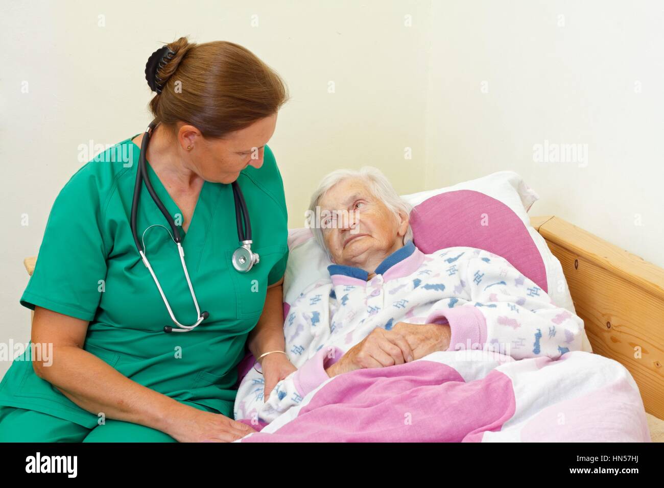 Elderly woman with her caregiver at home Stock Photo - Alamy