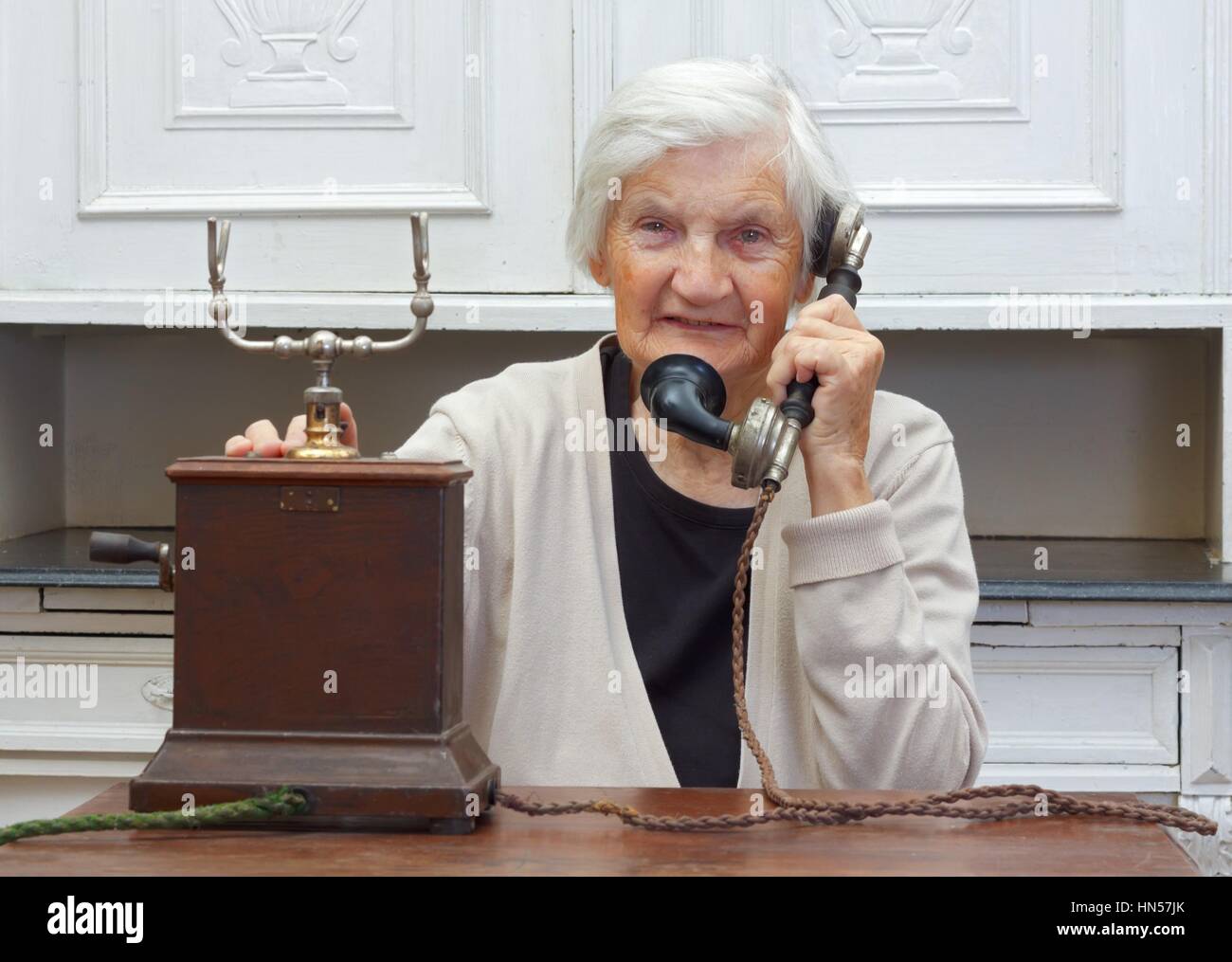 Elderly old fashioned phone hi-res stock photography and images - Alamy