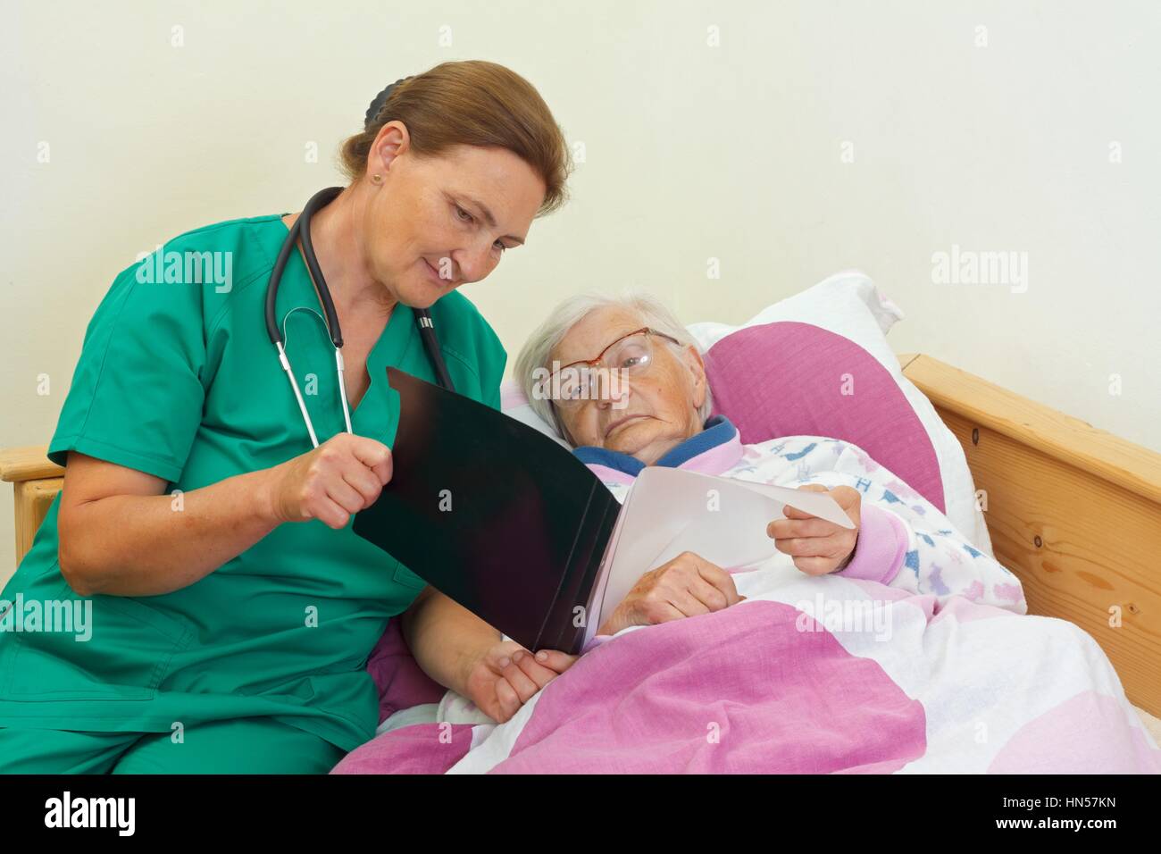 Elderly woman with her caregiver at home Stock Photo - Alamy