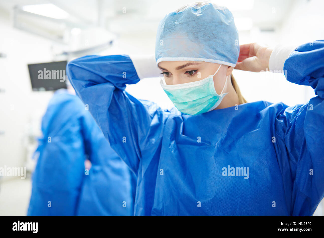 Young doctor during preparation for operation Stock Photo - Alamy