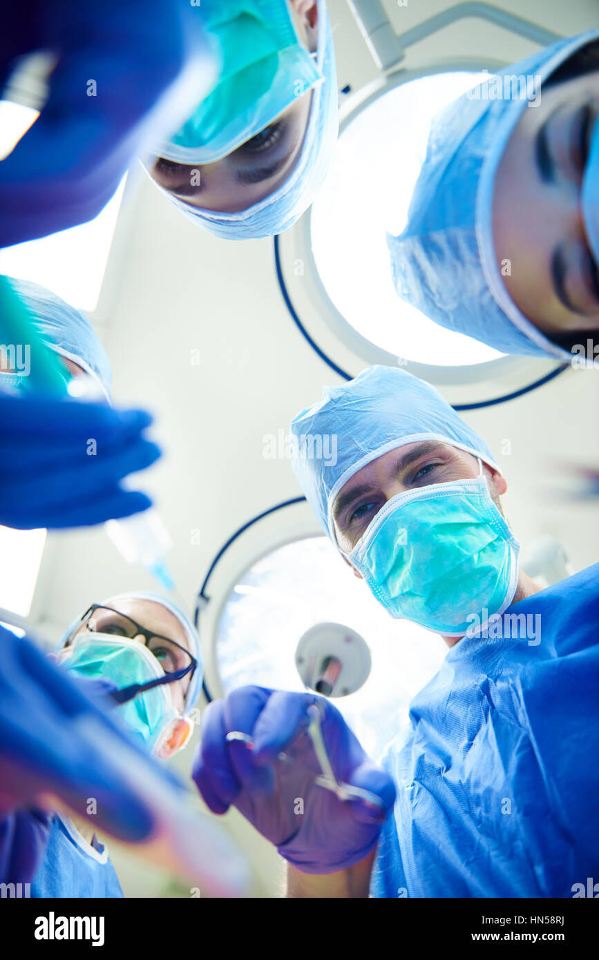 Low angle view of operating surgeons Stock Photo - Alamy