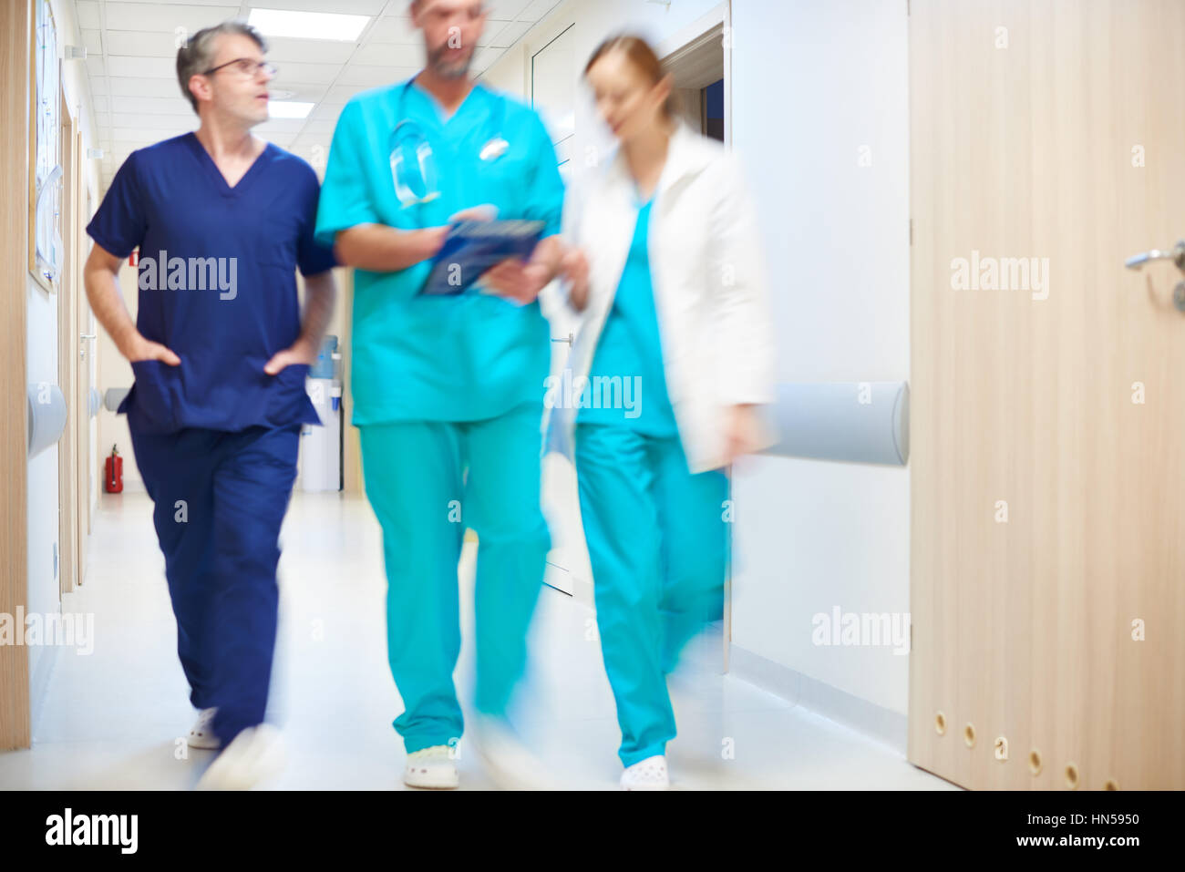 Doctors moving in blurred motion Stock Photo - Alamy