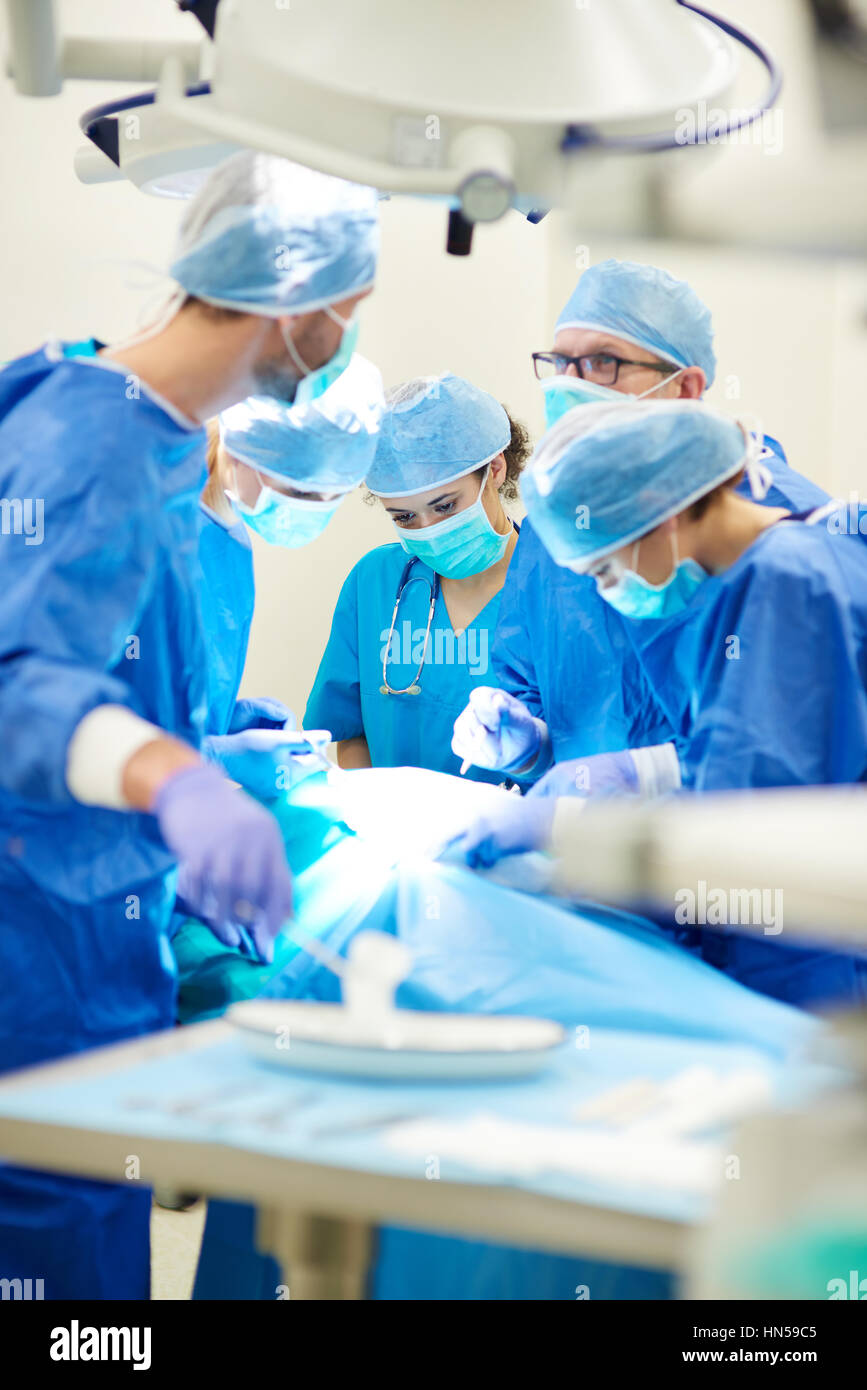 Busy doctors over the operating table Stock Photo - Alamy