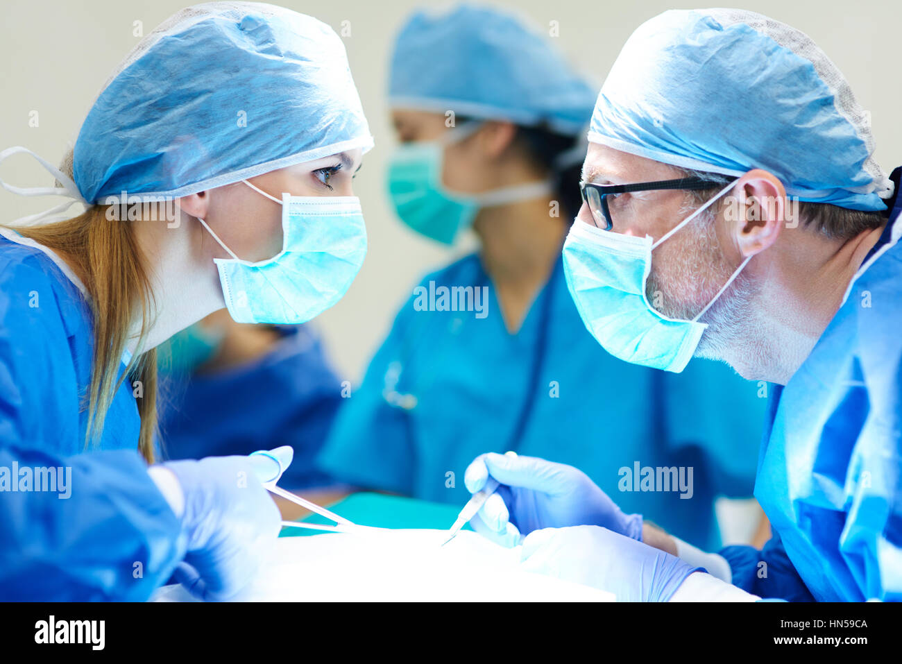 Two surgeons over operating table hi-res stock photography and images ...