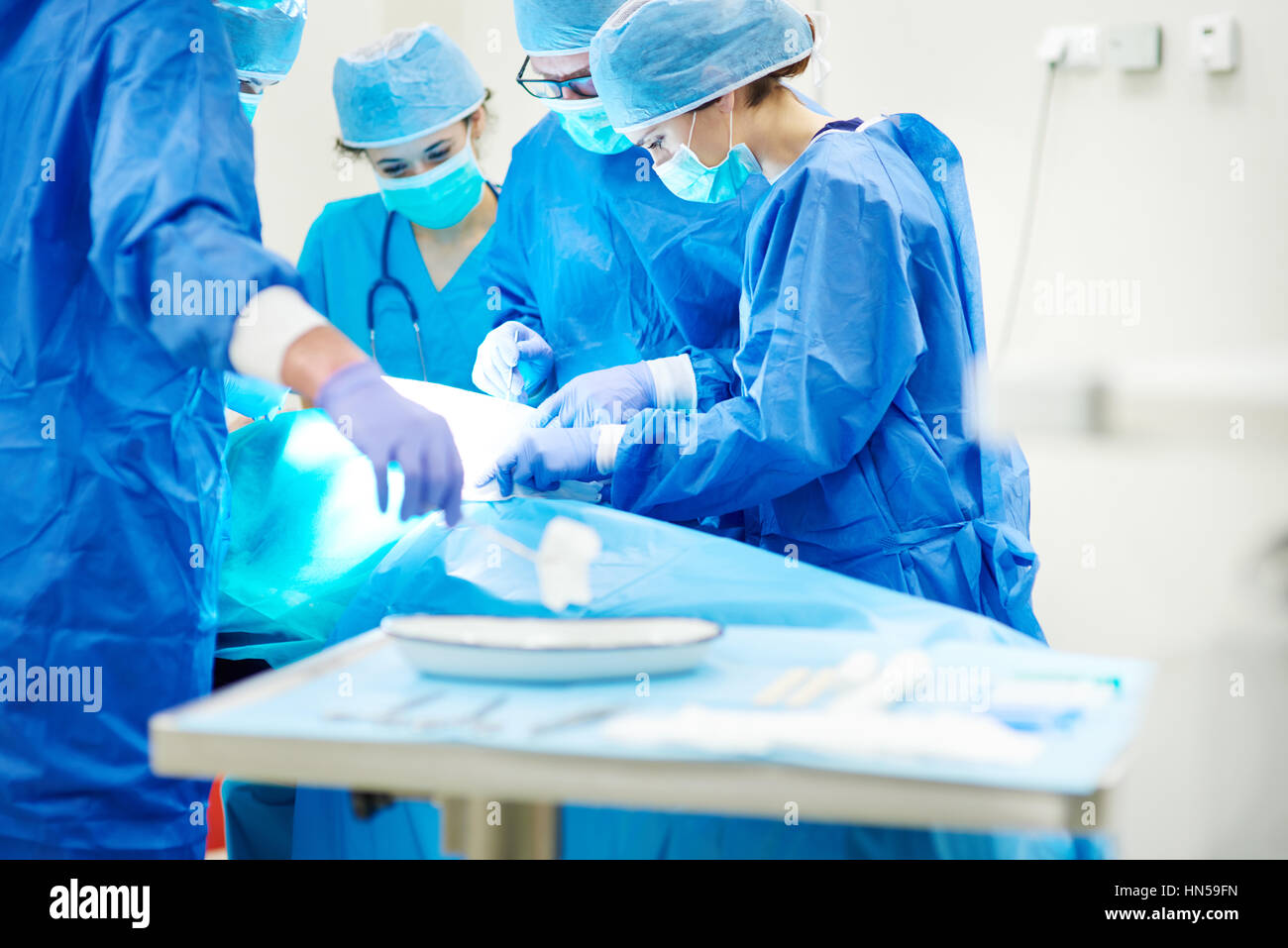 Busy surgeon doctors and serious operation Stock Photo - Alamy