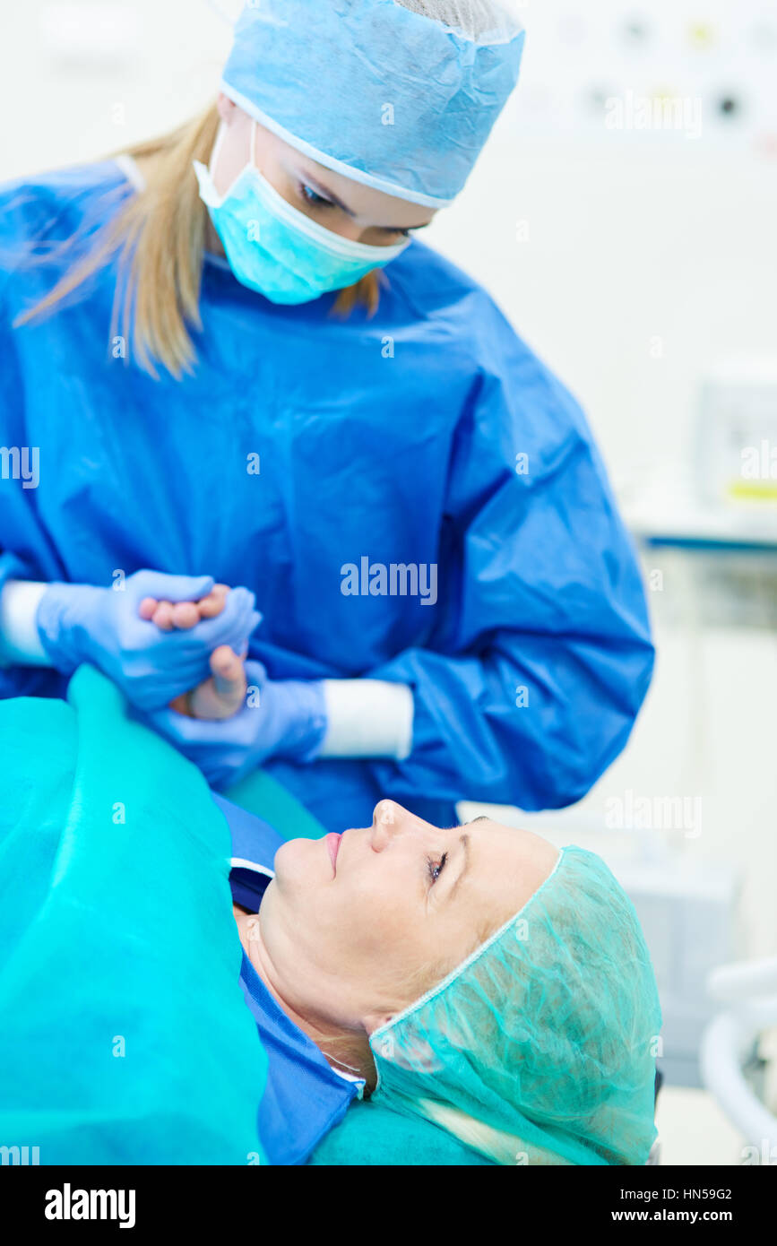 Woman lying on operating table hi-res stock photography and images - Alamy