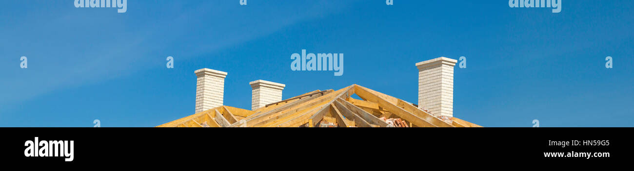 Roofing Construction. Wooden Roof Frame, White Chimneys and Yellow ...