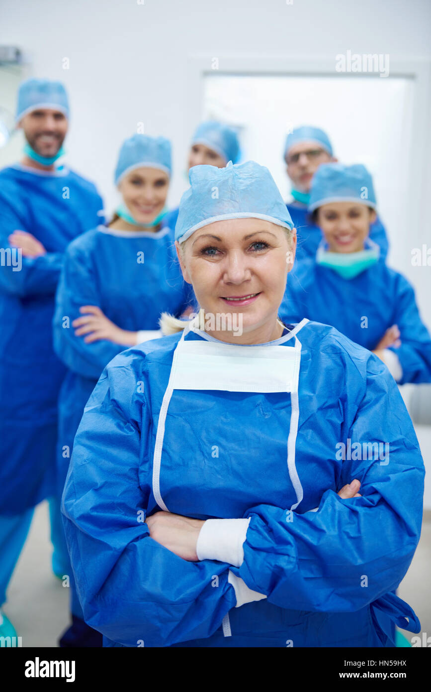 Mature woman as the leader of doctors team Stock Photo - Alamy