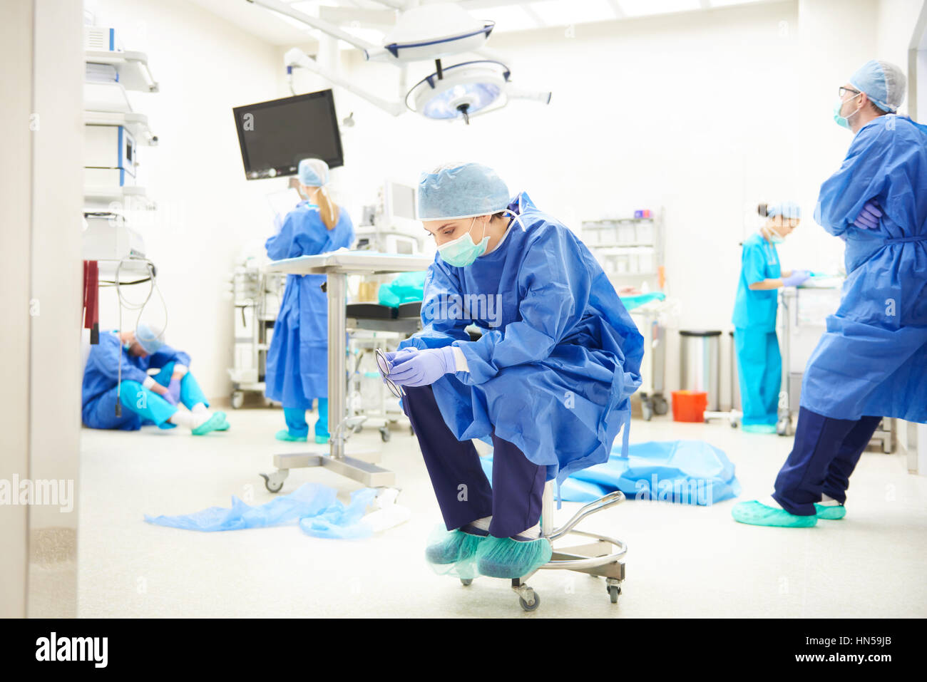 Operating room full of tired surgeons Stock Photo - Alamy