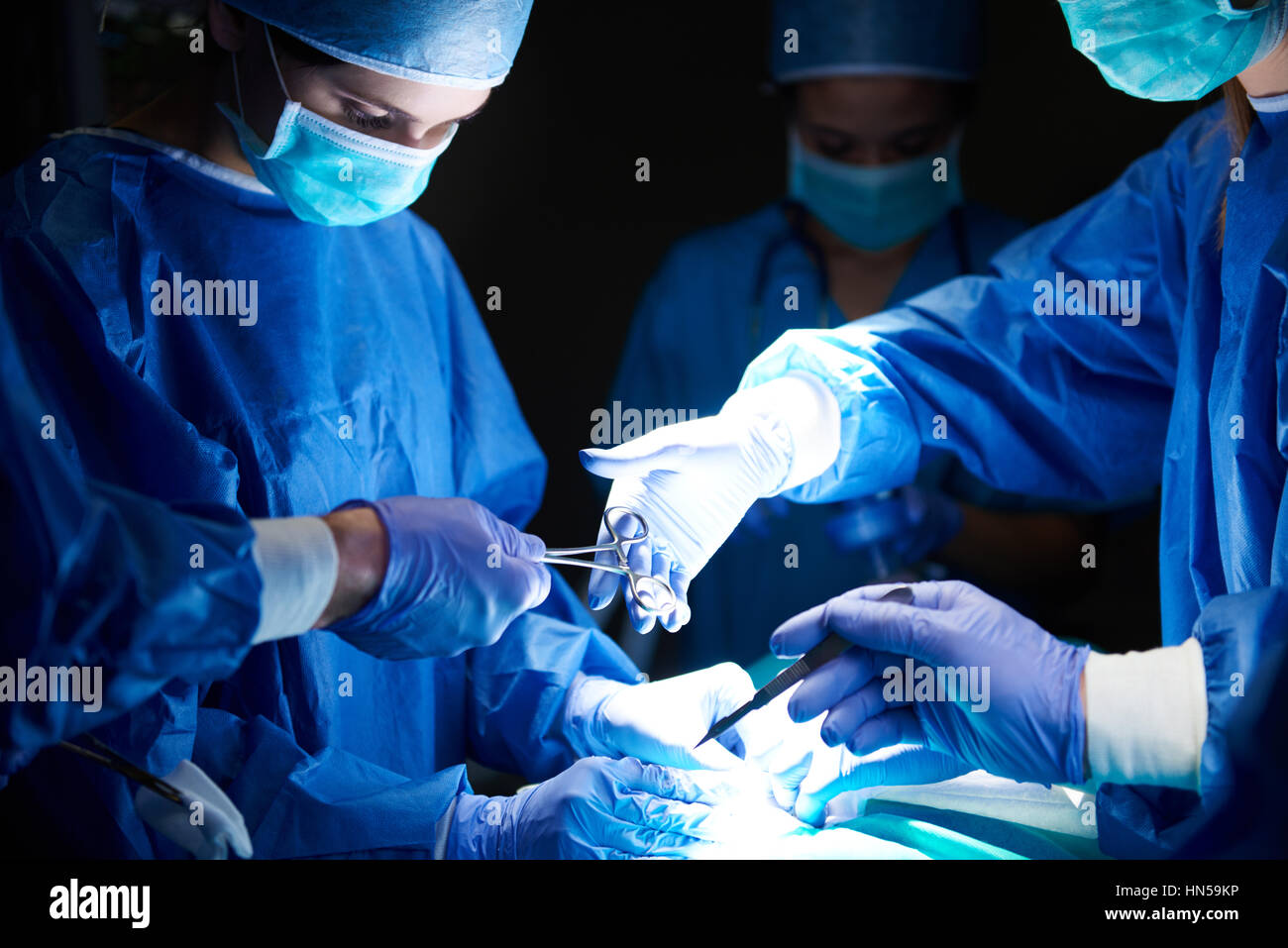 Surgeon getting ready to operate on a patient Stock Photo - Alamy