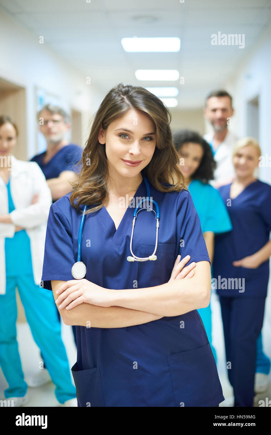 Female doctor and rest of team in the background Stock Photo - Alamy